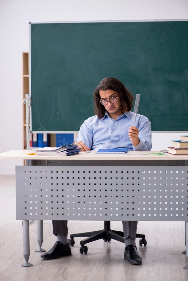 Young Male Teacher in Front of Green Board Stock Image - Image of study ...