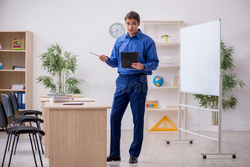 Young Male Teacher in Front of White Board Stock Image - Image of ...