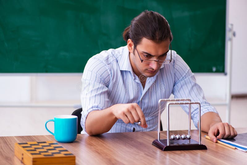 Young Male Teacher Physicist in Front of Blackboard Stock Image - Image ...