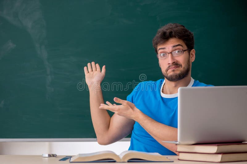 Young Male Teacher Student in Front of Green Board Stock Photo - Image ...