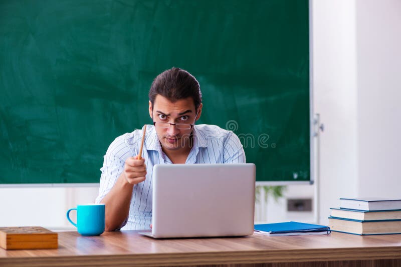 Young Male Teacher in Tele-education Concept in the Classroom Stock ...