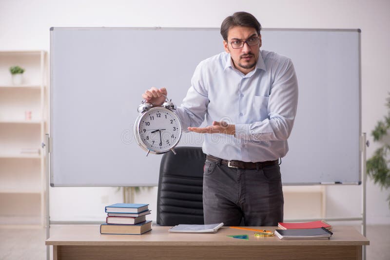 Young Male Teacher in Time Management Concept Stock Photo - Image of ...