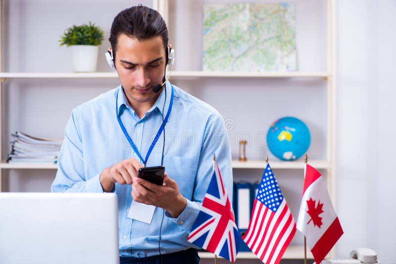 Young Male Travel Agent Working in the Office Stock Image - Image of ...