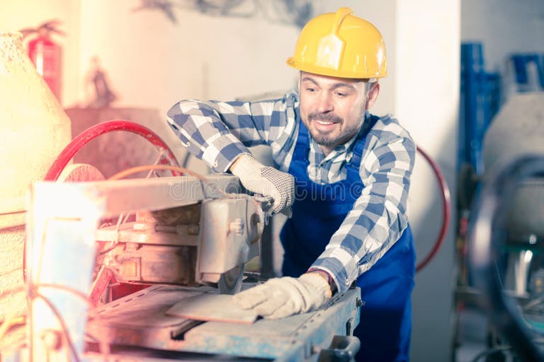 Young Male is Using Disk Saw To Cut Tile Stock Photo - Image of precise ...