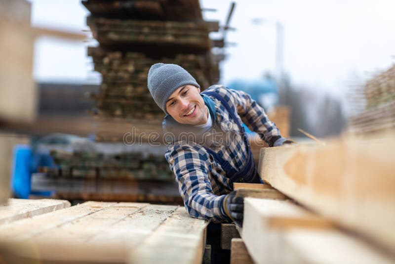 Young Male Worker in Timber Warehouse Stock Photo - Image of happy ...