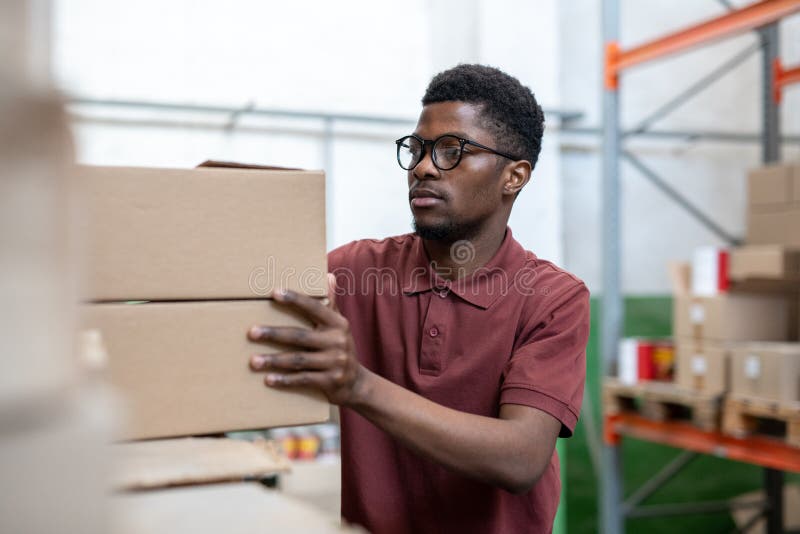 Young Male Worker of Warehouse Making Stack of Boxes Stock Image ...