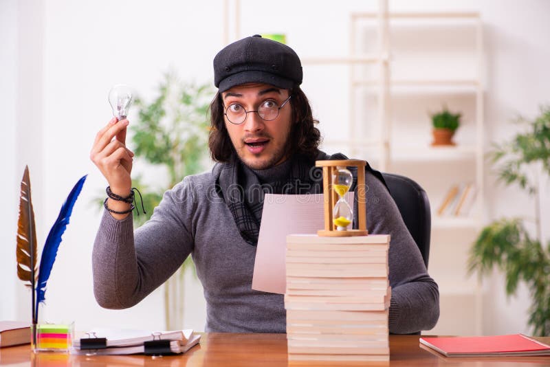 Young Male Writer in Time Management Concept Stock Photo - Image of ...