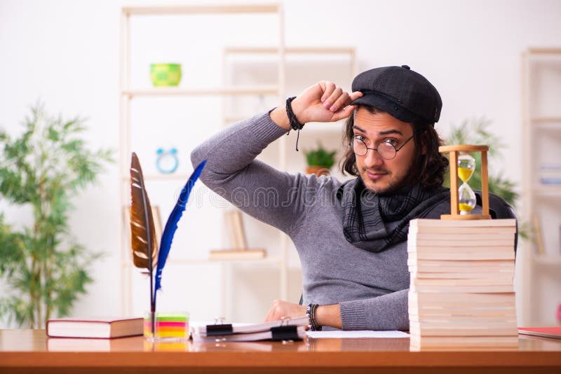 Young Male Writer in Time Management Concept Stock Photo - Image of ...