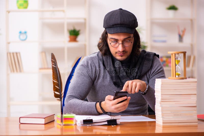 Young Male Writer in Time Management Concept Stock Photo - Image of ...