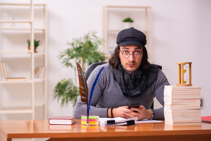 Young Male Writer in Time Management Concept Stock Photo - Image of ...