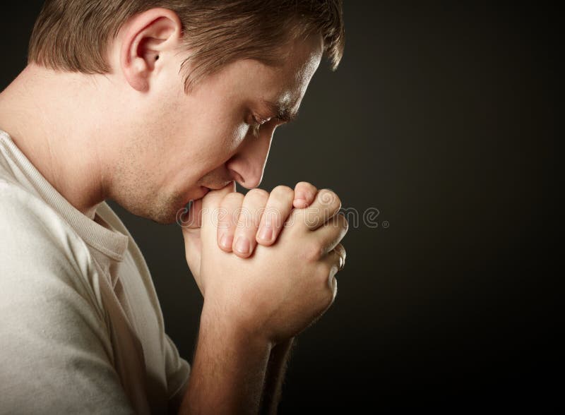 Young man praying stock photo. Image of prayer, religion - 18692752