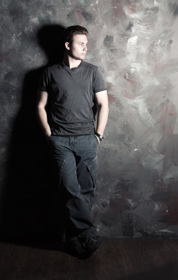 Man Standing in the Dark Grey Room Stock Photo - Image of small, floor ...