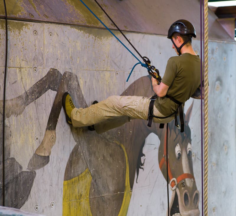 Young Man Abseiling editorial stock photo. Image of courageous - 97443868