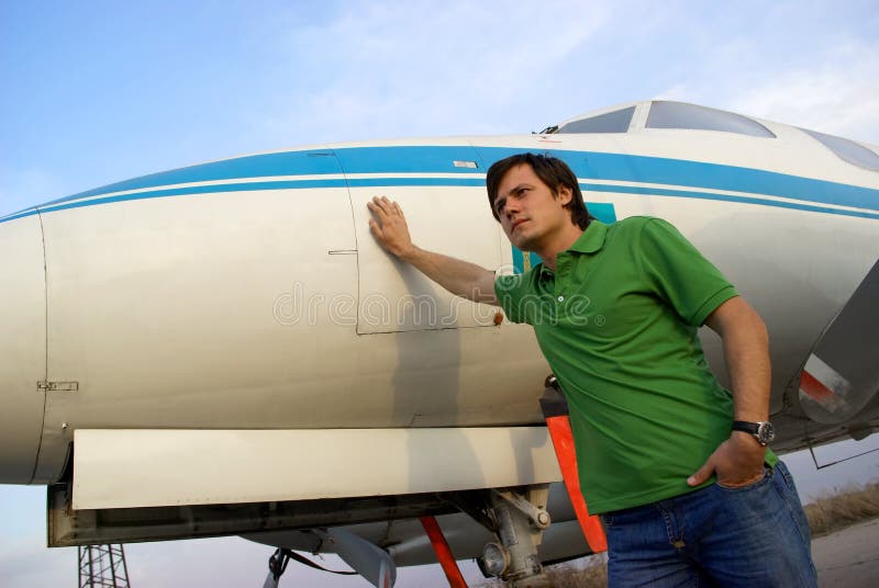 Young man beside airplane stock photo. Image of private - 4842286