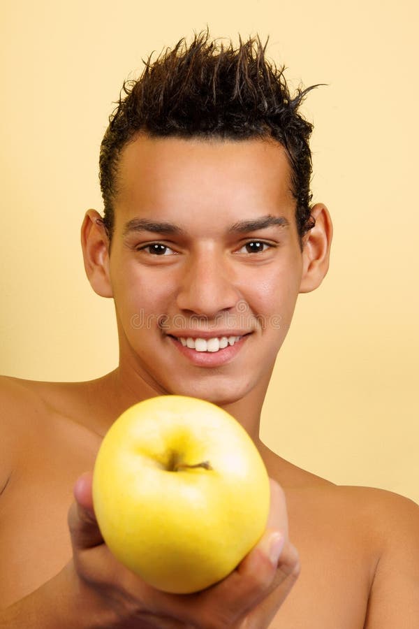 Young man with apple stock image. Image of male, muscle - 12344853