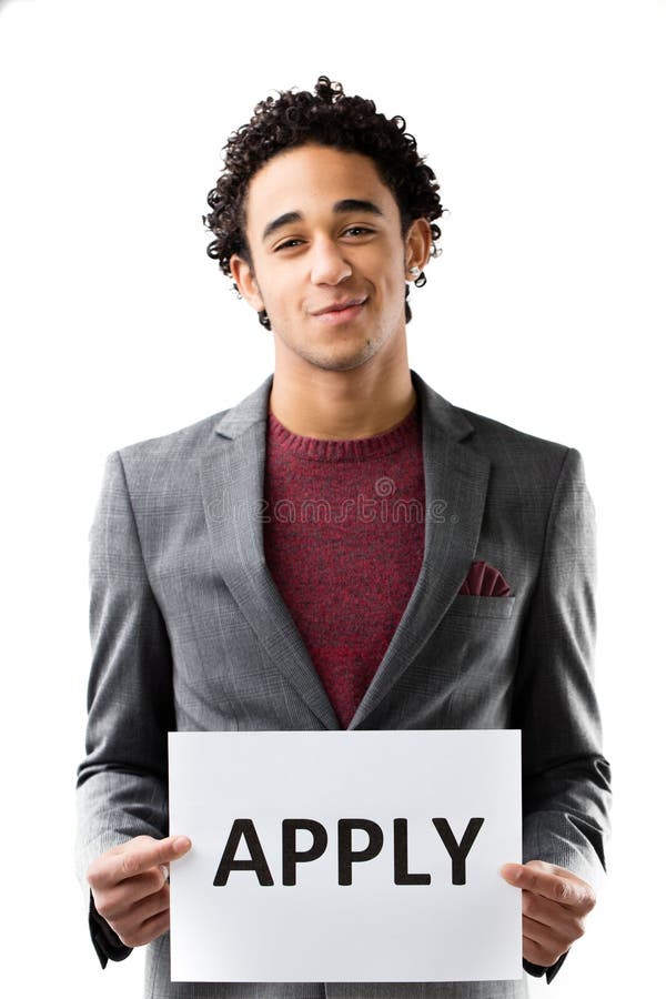 Young man with APPLY sign stock image. Image of people - 65450671
