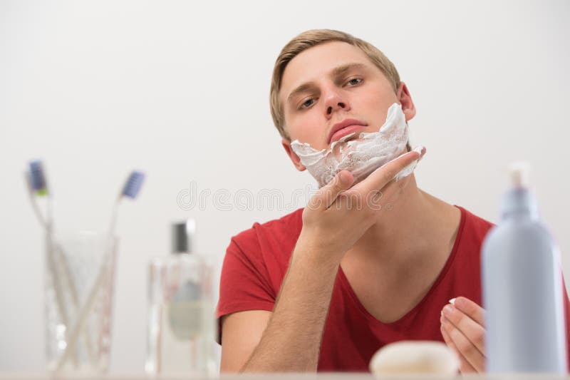 Young Man Applying Shaving Cream Stock Image - Image of body, color ...