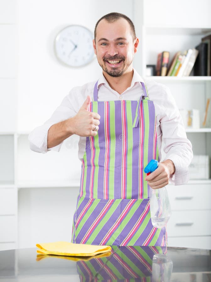 Young Man in Apron Cleaning Table Stock Image - Image of expression ...