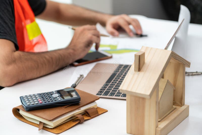 Young Man Architect or Engineer Working at Desk. Stock Image - Image of ...