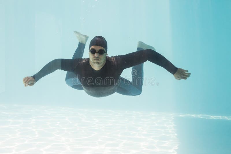 Young Man with Arms Outstretched while Swimming Stock Image - Image of ...