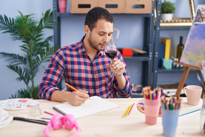 Young Man Artist Drinking Wine Drawing on Notebook at Art Studio Stock ...