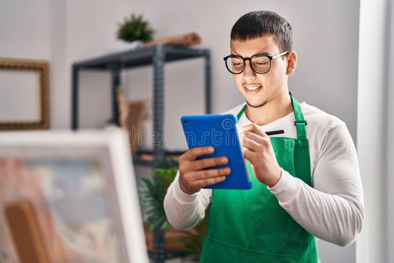 Young Man Artist Smiling Confident Drawing on Touchpad at Art Studio ...