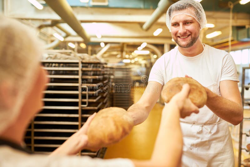Young Man As a Baker`s Apprentice in Training with Colleagues Stock ...