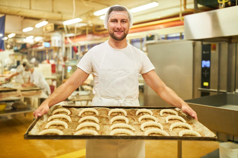 Baker Apprentice Carries Baking Tray with Croissants Stock Photo ...