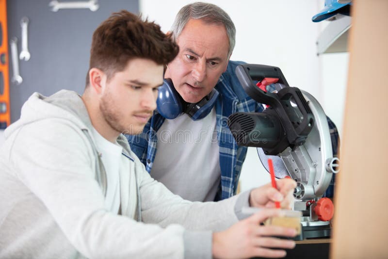 Young Man As Joiner in Training with Circular Saw Stock Photo - Image ...