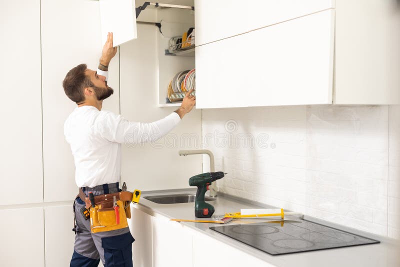 Young Man Assembling Kitchen Furniture Stock Image - Image of table ...