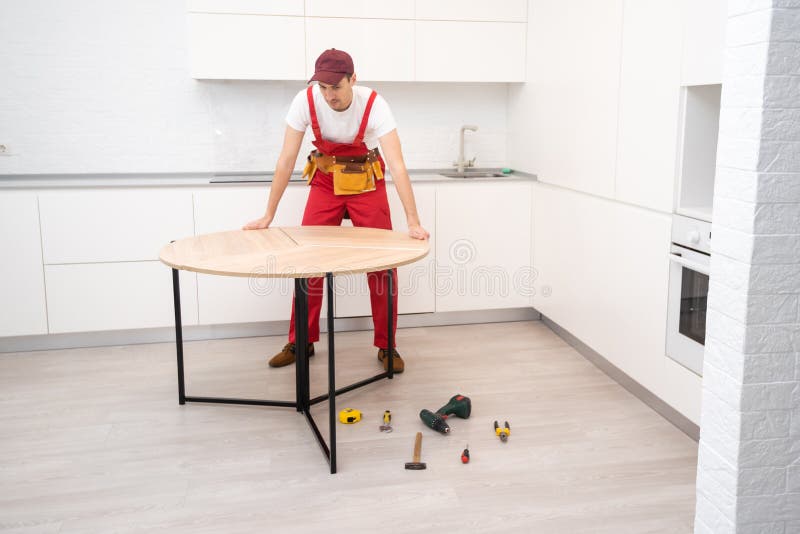 Young Man Assembling Kitchen Furniture. Stock Image - Image of assemble ...