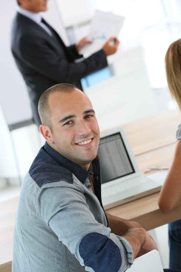 Young Man Attending Business Presentation Stock Photo - Image of ...