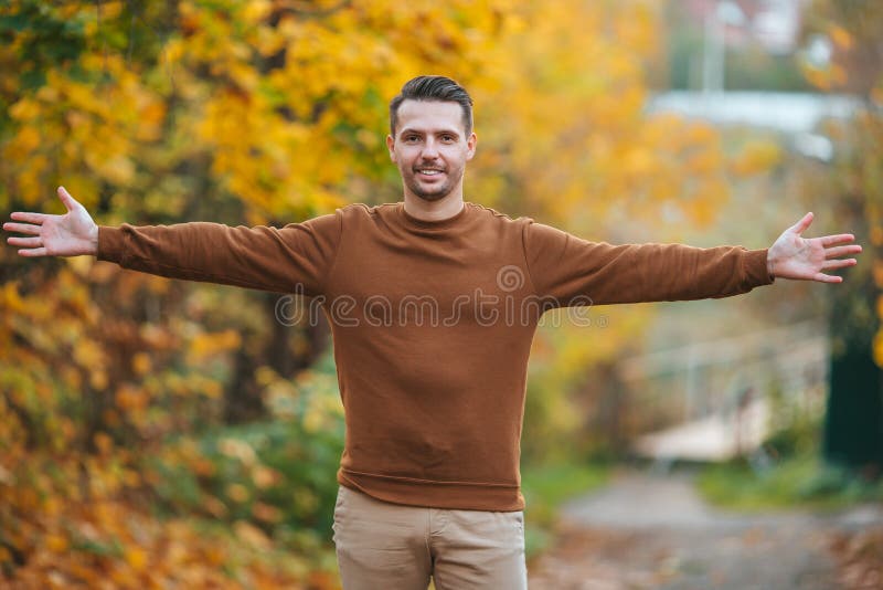 Young Man in Autumn Park Outdoors Stock Image - Image of park, foliage ...