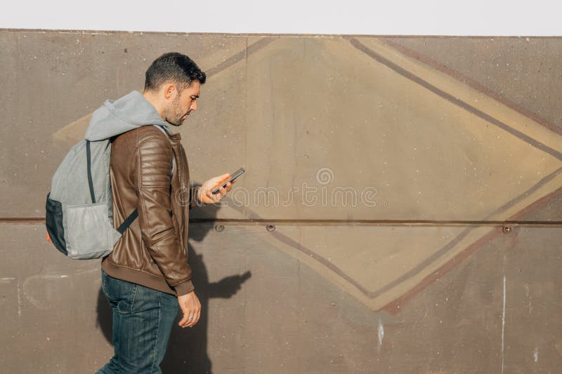 Young Man with Backpack and Mobile Phone Stock Image - Image of travel ...