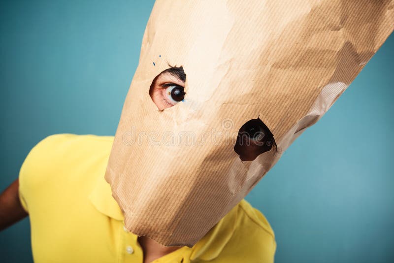 Young Man with Bag Over Head Looking at Camera Stock Image - Image of ...