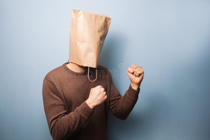 Young Man with Bag Over His Head in Fighting Stance Stock Photo - Image ...