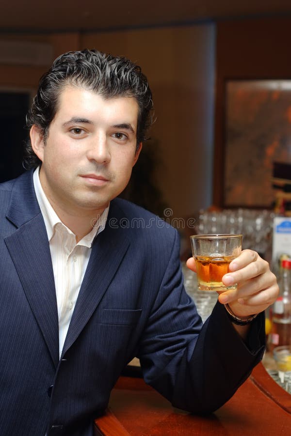 Young man in a bar stock image. Image of nightclub, drink - 2467003