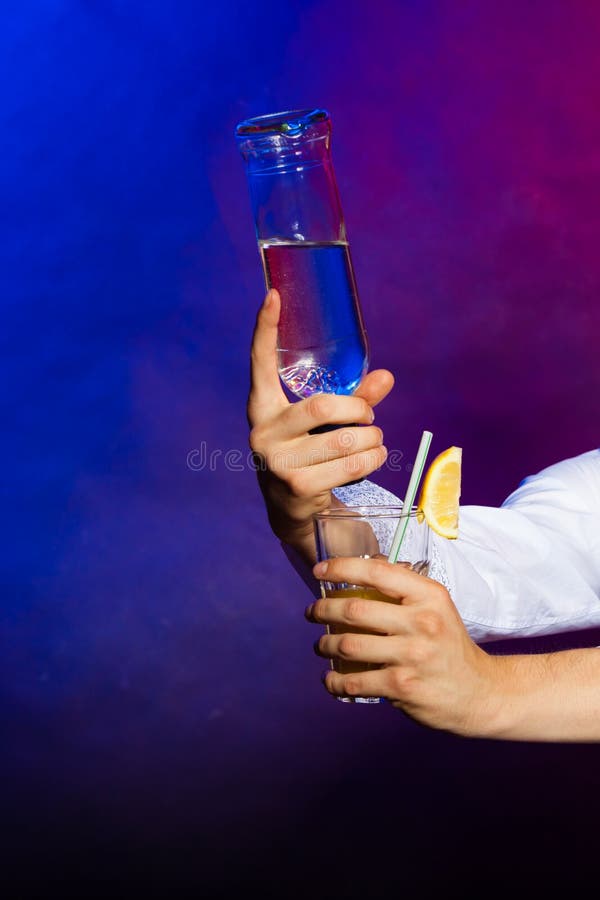 Young Man Bartender Pouring a Drink Stock Photo - Image of alcohol ...