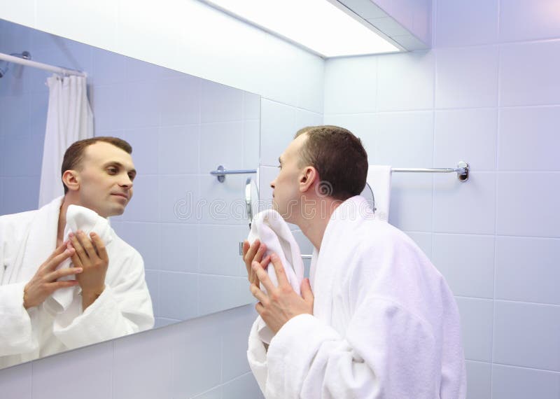Young man in bathroom stock image. Image of face, health - 19794823