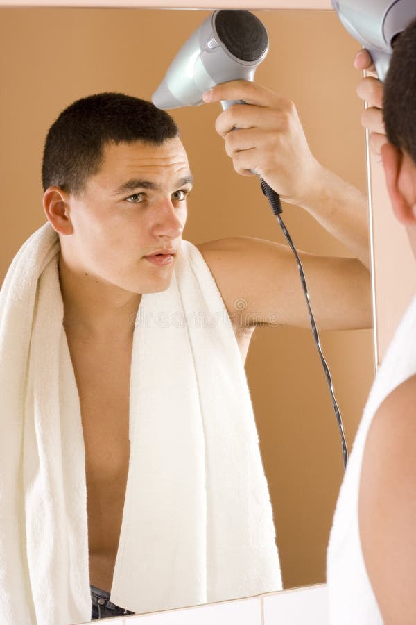 Young Man in the Bathroom S Mirror Using Hair Drier Stock Photo - Image ...