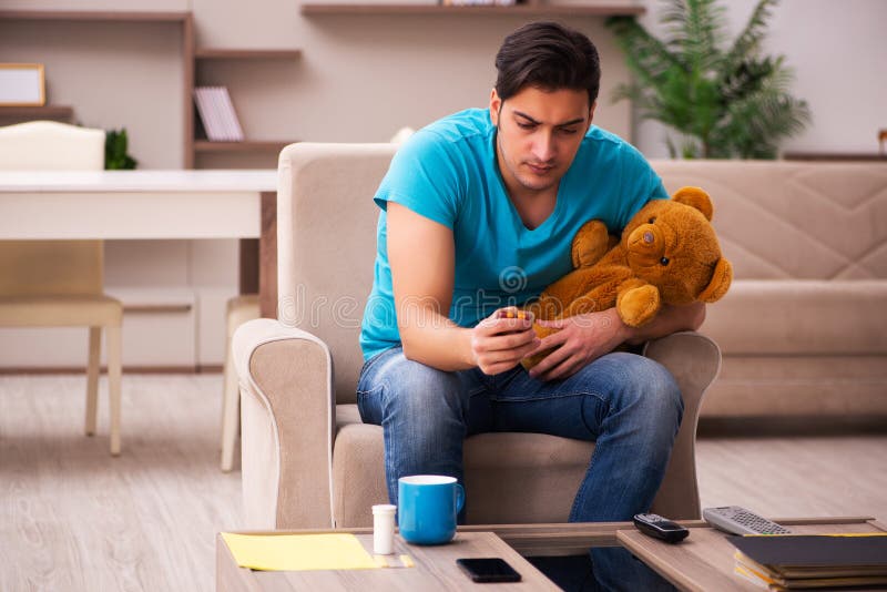 Young Man Sitting with Bear Toy at Home Stock Image - Image of play ...