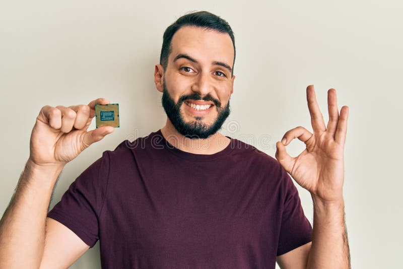 Young Man with Beard Holding Cpu Computer Processor Doing Ok Sign with ...