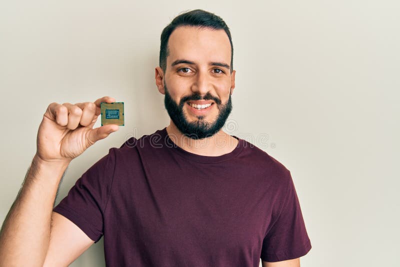 Young Man with Beard Holding Cpu Computer Processor Looking Positive ...