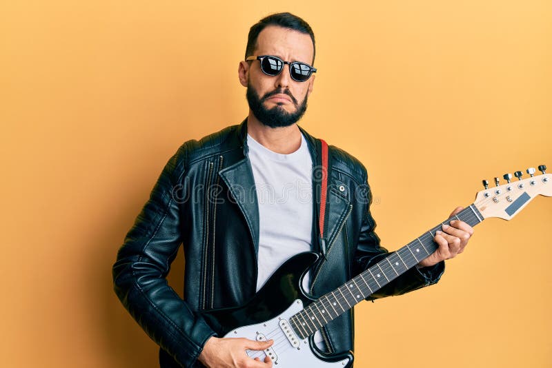 Young Man with Beard Playing Electric Guitar Depressed and Worry for ...
