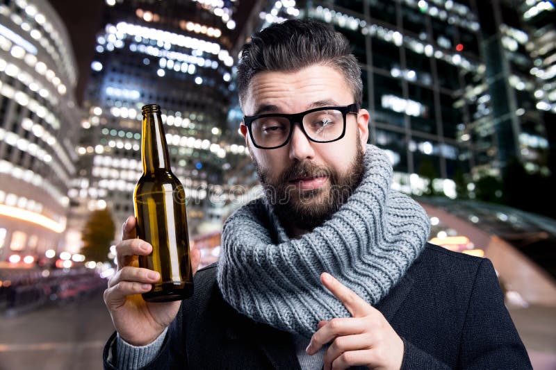 Young man with beer bottle stock photo. Image of cheerful - 63414090
