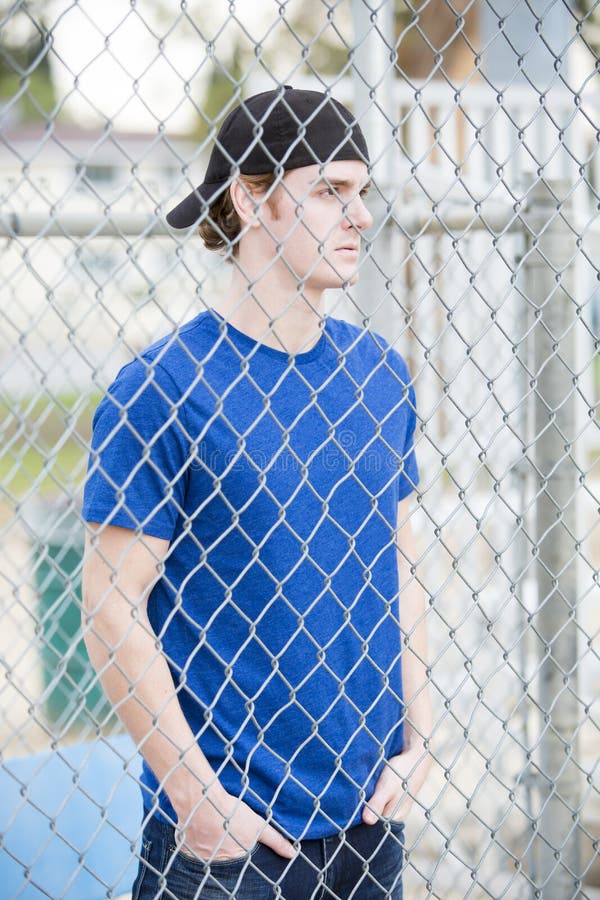 Young man behind a fence stock photo. Image of lifestyle - 48679870