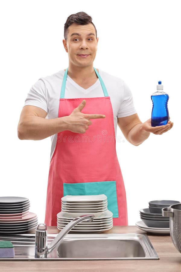 Young Man Behind a Sink Holding a Detergent and Pointing Stock Image ...