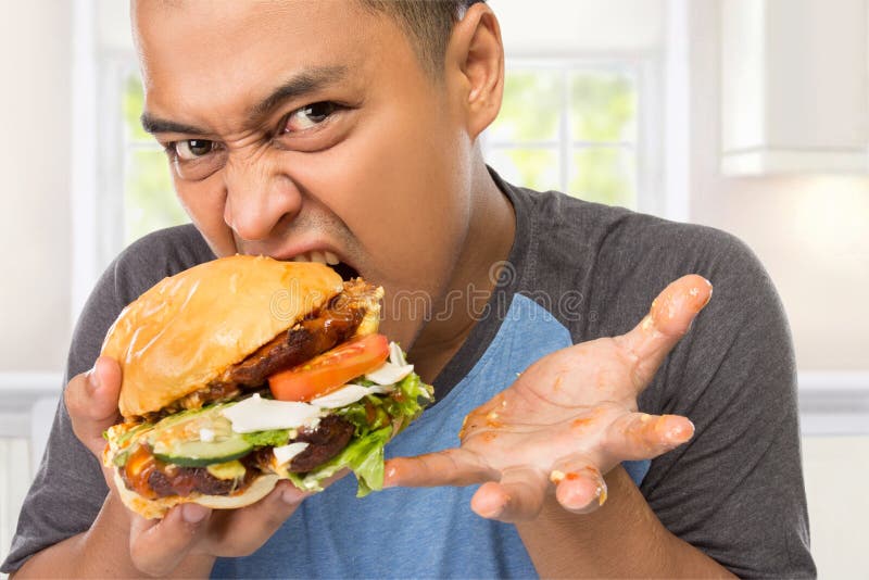 Young Man Bite His Big Burger Deliciously Stock Photo - Image of lunch ...