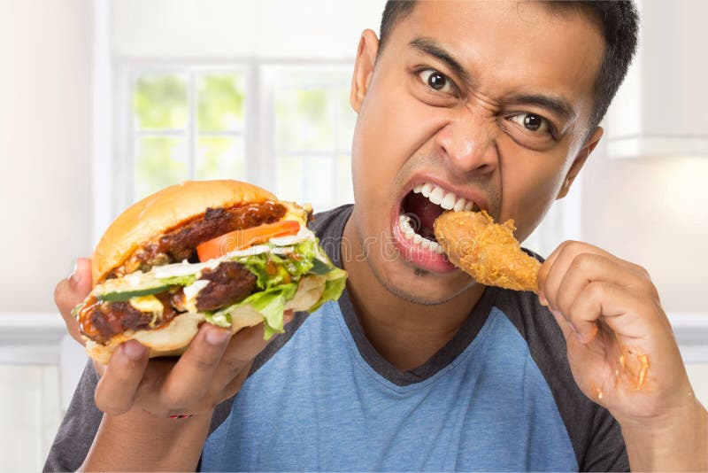 Young Man Bite His Drumstick Deliciously Stock Photo - Image of meal ...