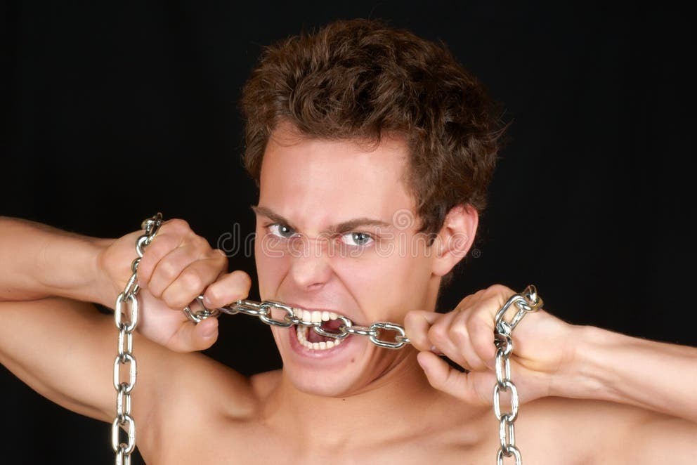 Young man biting a chain stock image. Image of portrait - 13997157